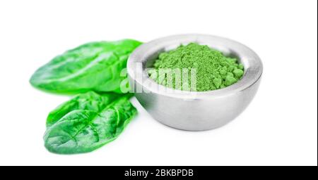 Spinach powder isolated on white background (close up; selective focus ...