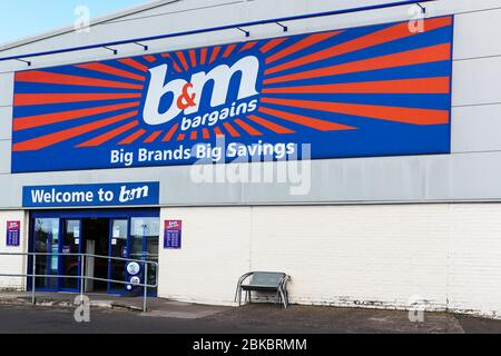 Trademark logo for B and M bargains general store on the outside wall ...