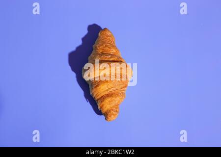 Bakery products baked croissant. Purple background, top view. Pop art ...