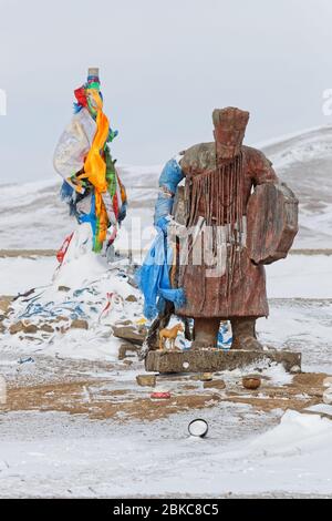 Shaman sculpture and ovoo. Ovoo are sacred stone heaps used as altars ...