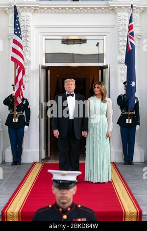 U.S. President Donald Trump is greeted by French President Emmanuel ...