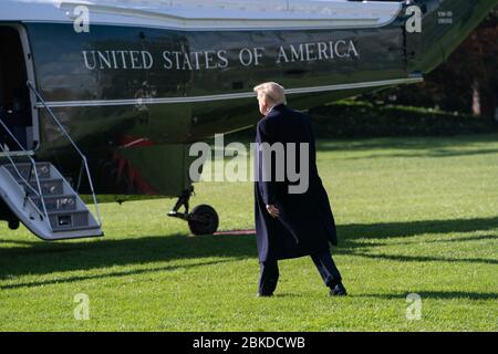 President Donald Trump walks to board Air Force One for a trip to ...