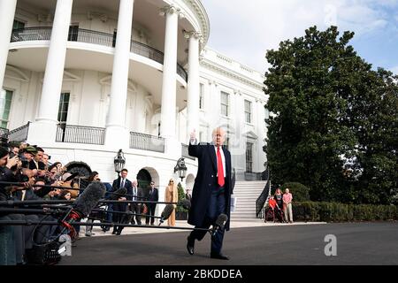 President Donald Trump walks to board Air Force One for a trip to ...