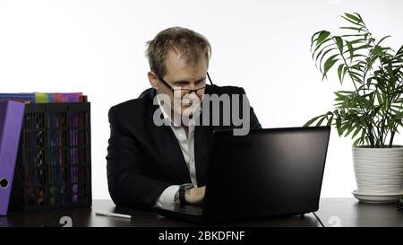 tired worker in the office. Disheveled girl with laptop Stock Photo - Alamy