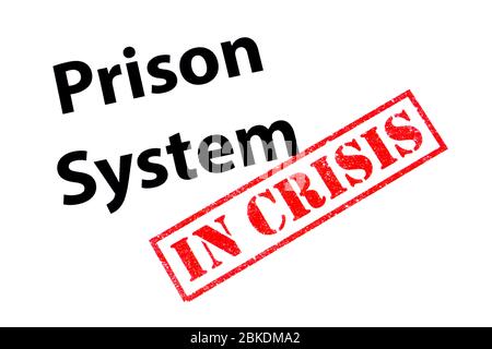 Prison System heading with a red IN CRISIS rubber stamp Stock Photo - Alamy