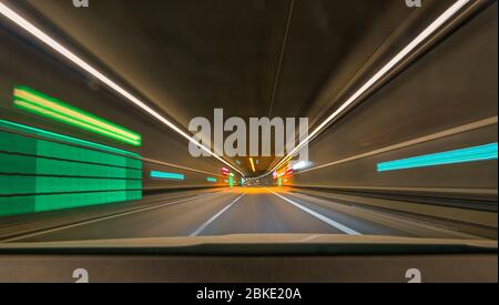 Moving car with blur light through Pilsudski Bridge at night in Torun ...