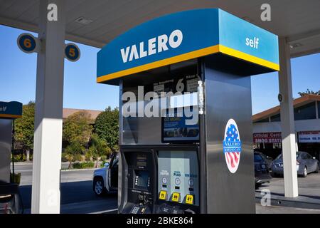 The Valero Energy logo is seen on an LED screen in the background while ...