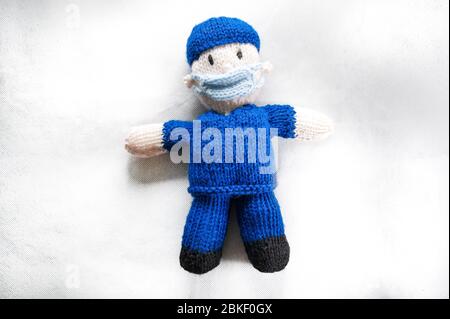 knitted nurse, front line worker on white background. covid 19 Stock ...