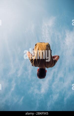 Free runner trains parkour while jumping in the air Stock Photo - Alamy