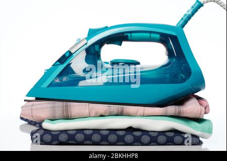 Stack of clean clothes isolated on white Stock Photo - Alamy