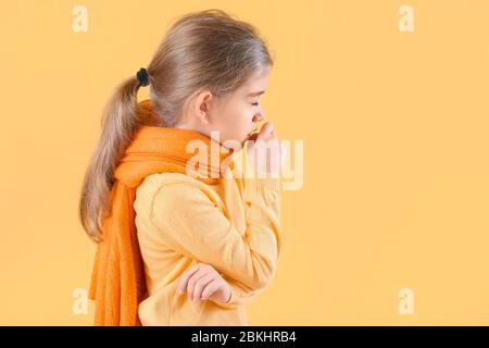Sick little girl on color background Stock Photo - Alamy
