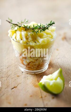 Lemon breaded fish parmentier Stock Photo - Alamy