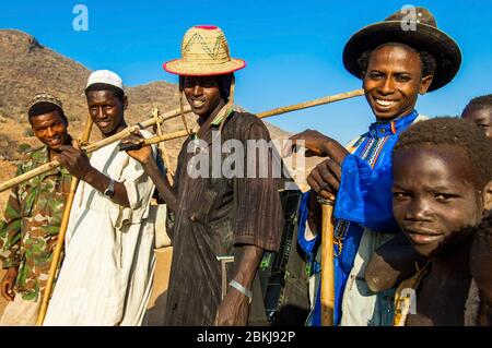 Sudan, south Kordofan, Nuba Hills, Nuba woman presenting a calabash of ...