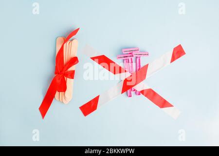 Shaving machine on a blue background with ice cubes. The concept of ...