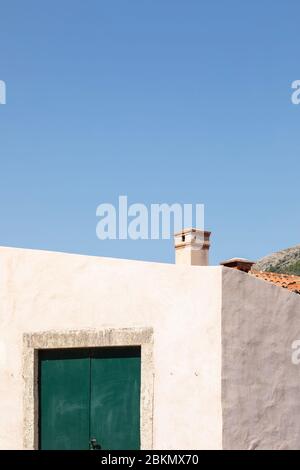 A minimalist dark green door in a modern building Stock Photo - Alamy