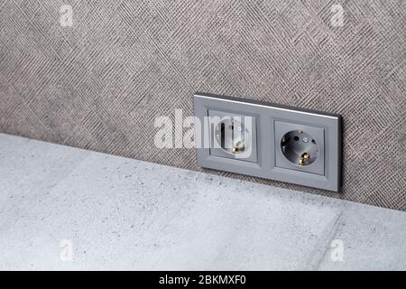 Socket gray with ground with an input for two devices. She is on the ...