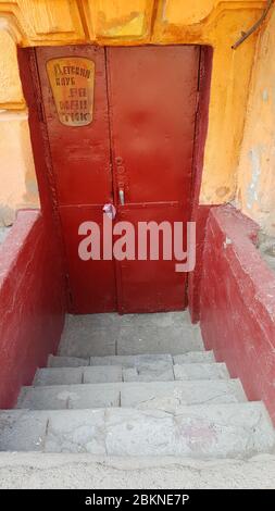 Red door into basement Ancient and retro red door, into a residence ...