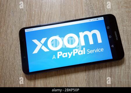 xoom logo is displayed on smartphone. Xoom Corporation is an electronic ...