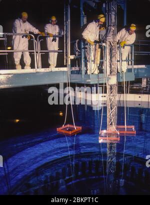 SCRIBA, NEW YORK, USA, 1985 - Technicians at work in control room ...