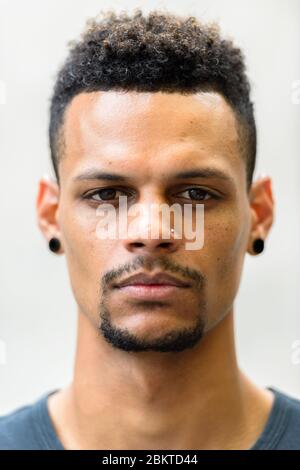 young bearded african man outdoors posing looking camera smiling - swag ...