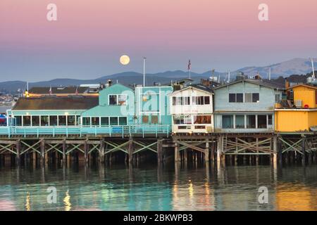 Early morning moonrise over fisherman's wharf in Monterey, CA Stock ...