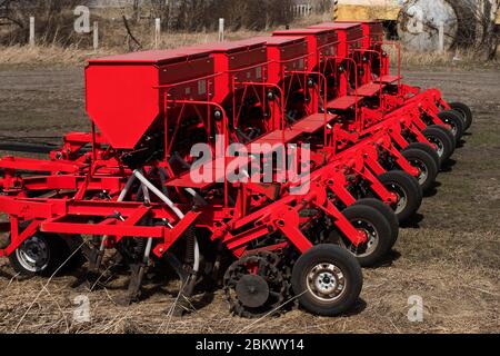 Row seed drill grain. Seed sowing device. Agricultural activity. Close ...