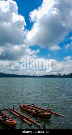 views of the lake with small boats floating Stock Photo - Alamy