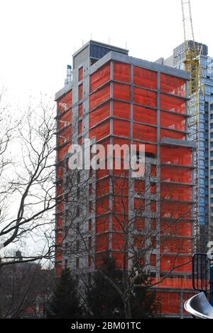 Tower cranes of heights at a building under site during the ...