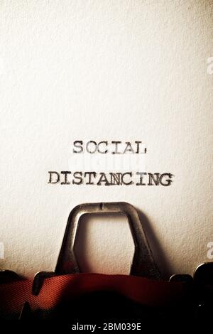 Social distancing text written with a typewriter Stock Photo - Alamy