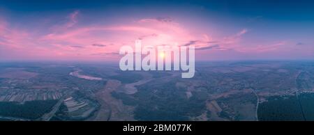 red and orange countryside sunset during the early morning dusk ...