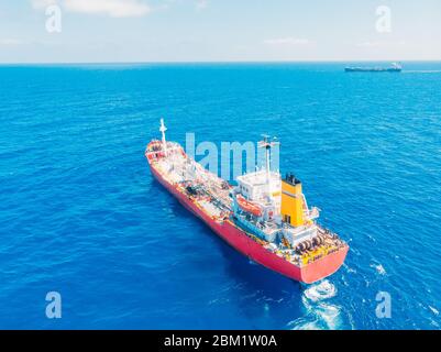 Oil ship chemical tanker sails blue sea. Aerial top view. Concept ...