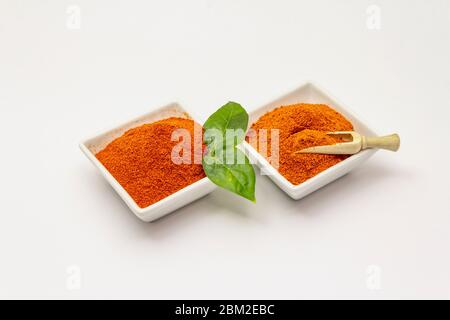 Two types of Hungarian paprika powder, hot and sweet, isolated on white ...