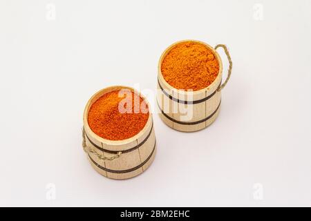 Two types of Hungarian paprika powder, hot and sweet, isolated on white ...