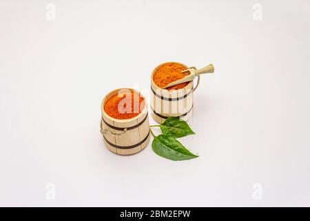 Two types of Hungarian paprika powder, hot and sweet, isolated on white ...