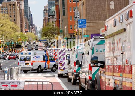 Ambulances line up outside a NYC hospital emergency room waiting for ...