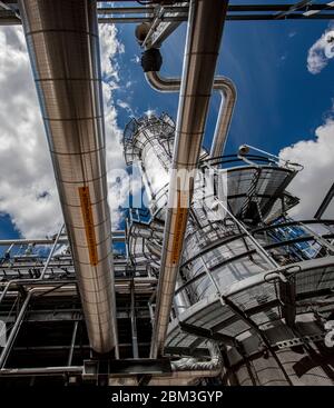 Natural gas plant structures against blue sky Stock Photo - Alamy