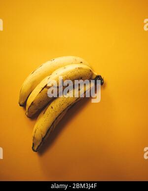 Raw Yellow Organic Bananas in a Bunch Stock Photo - Alamy