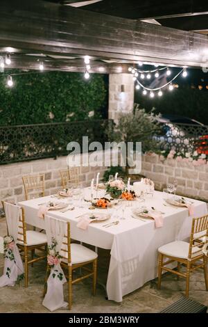 a decorated table decorated with flowers and cloth napkins Stock Photo ...