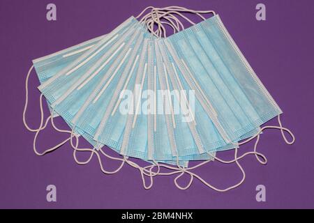 Cotton protective masks on color background Stock Photo - Alamy
