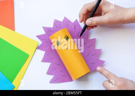 DIY a child makes a cute hedgehog from cardboard and colored paper ...