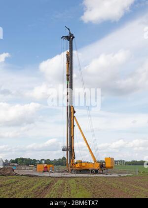 Foundation drill machine in the dutch flat landscape Stock Photo - Alamy