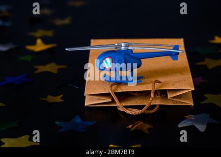 Blue Toy Helicopter Delivers Gift Paper Bag. Father's day, Birthday ...