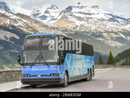 Snow Coach tour bus at the Athabasca Glacier. The Athabasca is the most ...