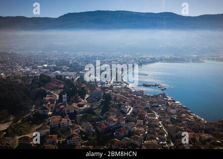 Panoramic image of hillside red tiled rooftop houses on the shore of ...