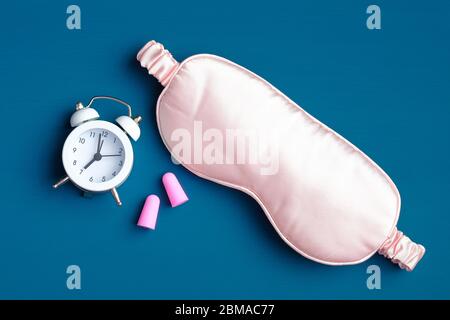 Female sleep routine accessories on blue background Stock Photo - Alamy