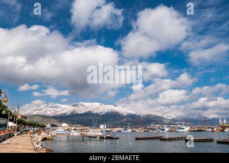 Small port and snowy mountain landscape scene at peloponnese district ...