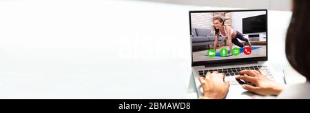 Watching Online Yoga Video Program Exercise On Laptop Computer At Home ...