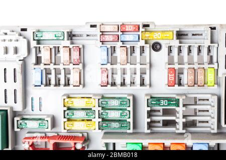 Plastic fuse box inside the engine compartment, visible fuses, relays ...