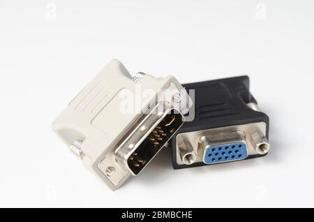 Vga plug of white dvi-d adapter and blue vga socket monitor cord near ...