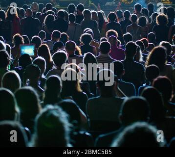 Audience enjoying live concert Stock Photo - Alamy